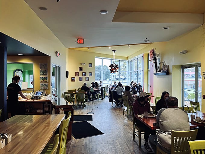 Inside, yellow chairs pop against warm wooden floors while natural light floods the space&mdash;proof that "simple" doesn't mean boring in this breakfast paradise.