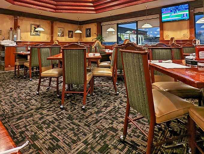 Rich wood paneling and comfortable booths create that perfect "settle in and stay awhile" atmosphere where breakfast decisions deserve serious contemplation.