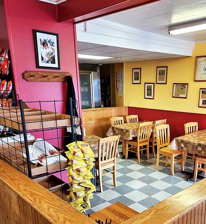 Red and yellow walls frame a dining room where conversations flow as freely as the coffee, creating Vermont's coziest sandwich sanctuary.