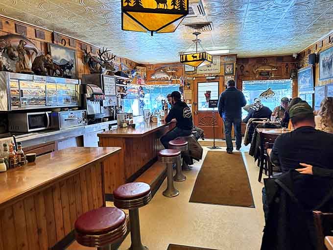 Step inside and time slows down. Wood paneling, mounted trophies, and counter seating create the authentic Montana diner experience that no trendy brunch spot could replicate.