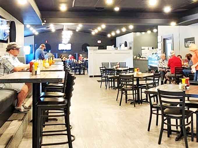 Inside, string lights and simple furnishings create that perfect "stay awhile" atmosphere where conversations flow as freely as the coffee