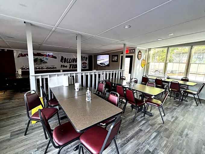 Simple tables, burgundy chairs, and the promise of barbecue bliss. This dining room has witnessed more food euphoria than a cooking show highlight reel.