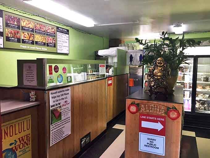 Inside, the no-frills mint green interior says everything you need to know: this place is about the food, not the ambiance. That laughing Buddha knows what's up.