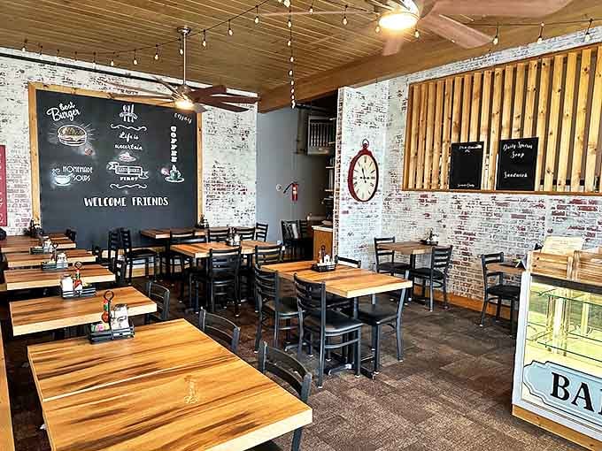 Exposed brick walls and string lights create the perfect backdrop for life's important conversations. The chalkboard's "Welcome Friends" isn't just signage—it's a promise.