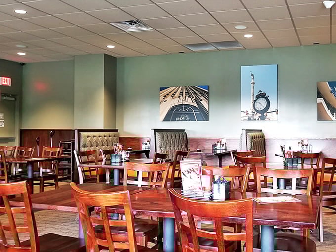 Warm wooden tables and comfortable booths create that perfect "stay awhile" atmosphere, with urban photography adding just enough visual interest.