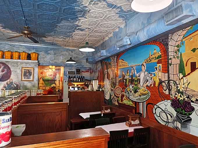 Step inside and you're transported to an Italian dreamscape. These hand-painted murals aren't just decoration&mdash;they're a promise that what you're about to eat has soul.
