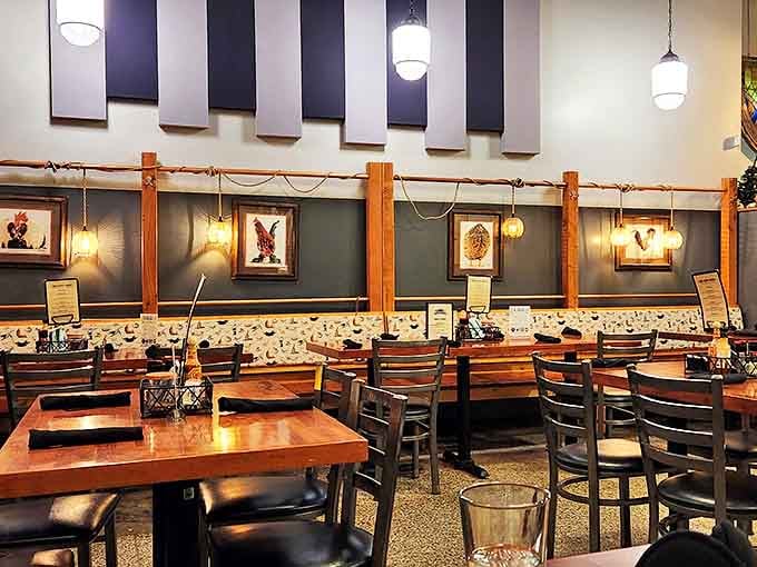 Industrial-chic meets rustic comfort in this dining room where wooden beams and pendant lighting create the perfect backdrop for serious meat appreciation.
