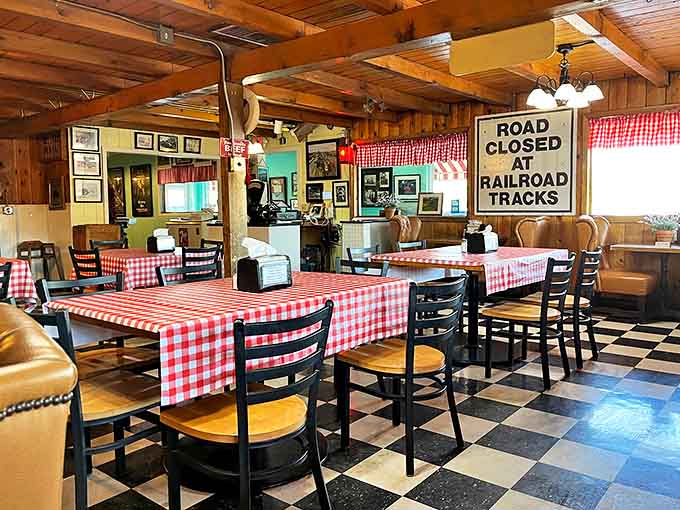 Step inside and time slows down – classic checkered tablecloths, wood-paneled walls, and that "Road Closed" sign telling a story of Albuquerque's railroad past.