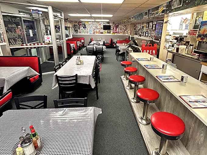 Classic Americana in every corner—red vinyl booths, counter seating with swivel stools, and checkered tablecloths that whisper, "Stay awhile, friend."