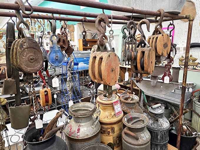 Industrial-age pulleys and milk cans hang like historical fruit, ready to be plucked by collectors who appreciate yesterday's workmanship.