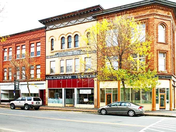 Historic brick buildings line Houlton's charming main street, where small-town character meets surprising affordability.