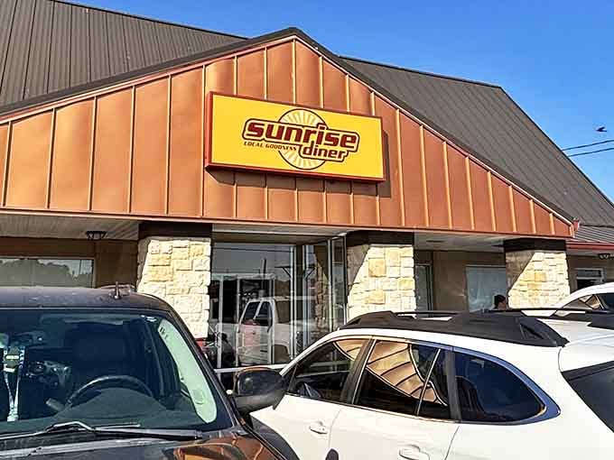 The welcoming glow of Sunrise Diner's sign promises hearty meals that'll keep you fueled from sunup to sundown.