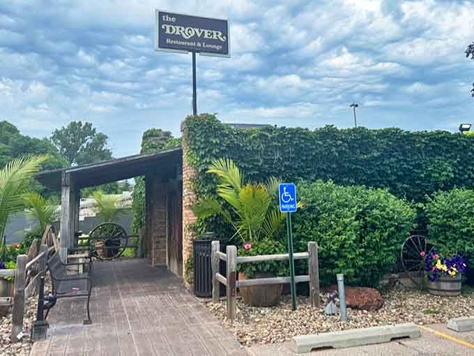 Lush ivy blankets the building like nature's own welcome mat, while wagon wheels promise Old West hospitality.