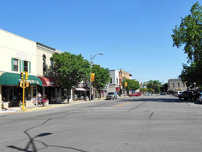Tree-lined streets invite leisurely strolls past buildings that have weathered decades with graceful dignity.