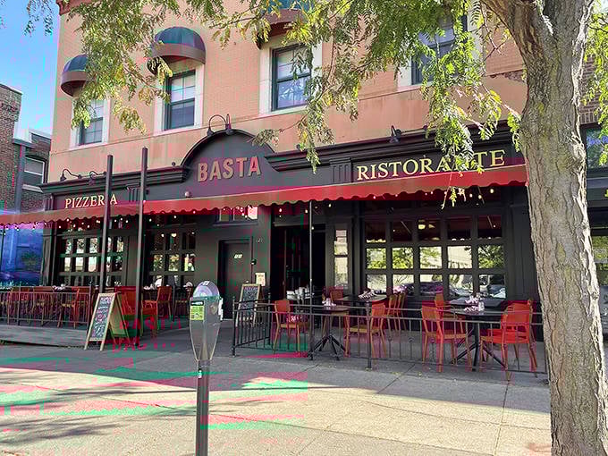 The elegant black and red exterior of Basta whispers "come inside" - your taste buds will thank you for listening.