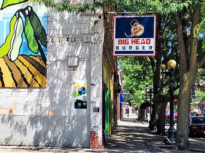 Where cartoon mascots and serious burger craftsmanship meet. This Waterloo gem's colorful sign is just the beginning of the story.