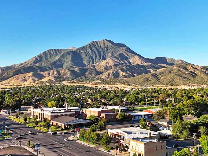 The mountains stand guard over Nephi's quiet streets, where the biggest traffic jam might be two pickup trucks stopping to chat.