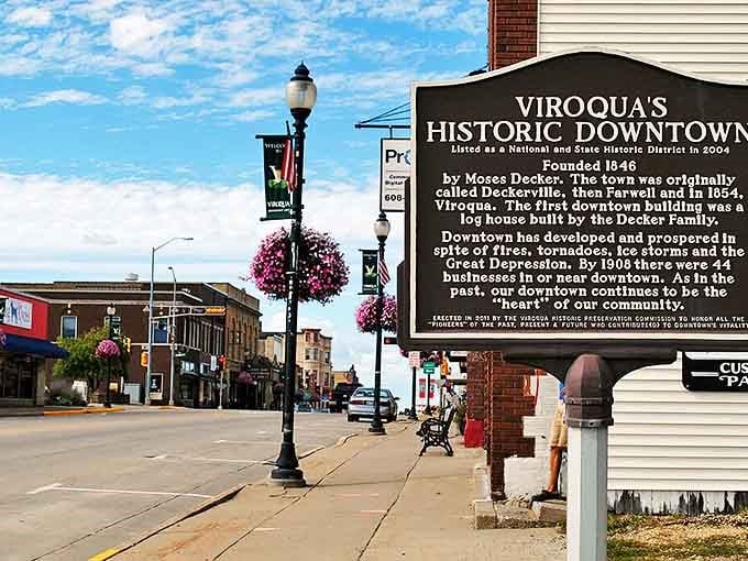 A historic marker tells Viroqua's story - from log cabins to organic farming hub, this town has evolved while keeping prices down.