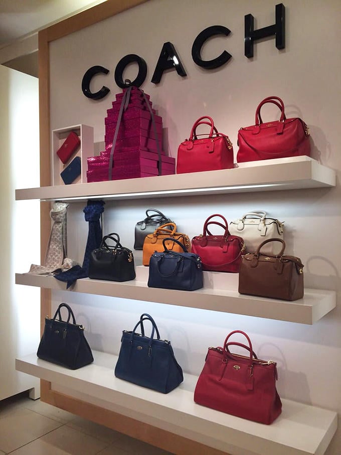 Coach handbags arranged like fine art&mdash;proof that luxury and savings aren't mutually exclusive on the Oregon coast.