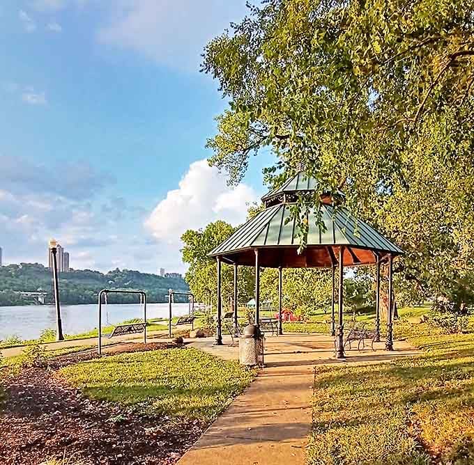 A riverside gazebo where contemplation comes free of charge. This peaceful spot along the Ohio River provides the perfect setting for morning coffee or evening reflection.