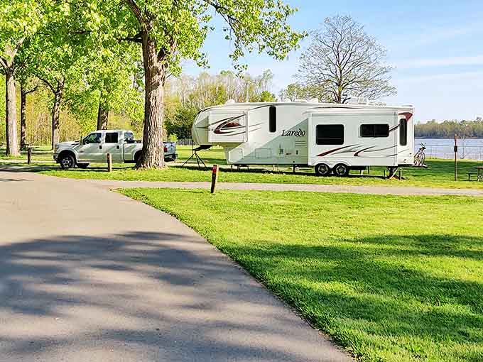 Camping with a view that beats any five-star hotel. RVs find their perfect parking spot along the riverbank, where nature provides the ultimate room service.