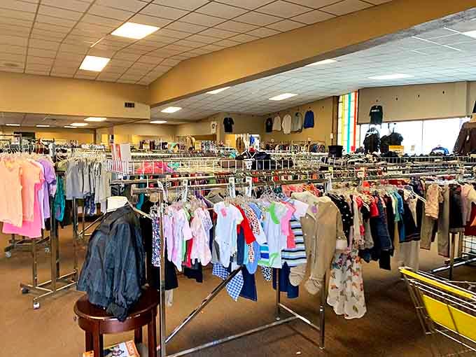 Racks upon racks of possibility! The clothing section stretches like a textile sea, organized by size and type.