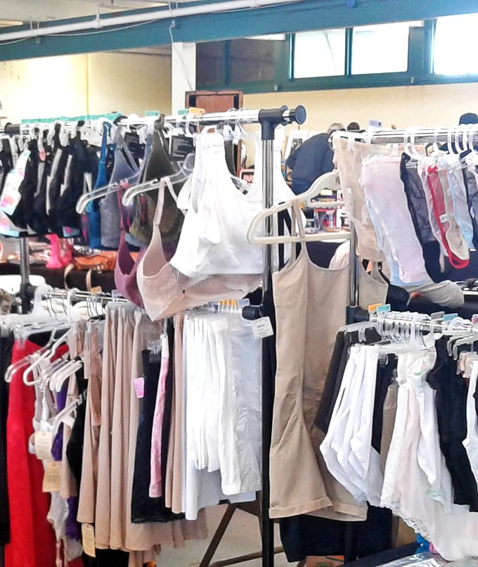 Fashion archaeology at its finest. Each rack tells stories of decades past, with garments waiting for their second act in someone else's wardrobe.
