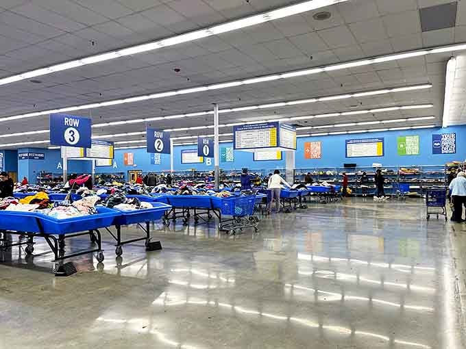 Blue bins stretch to the horizon like an ocean of possibilities, each one a potential gold mine of forgotten treasures.