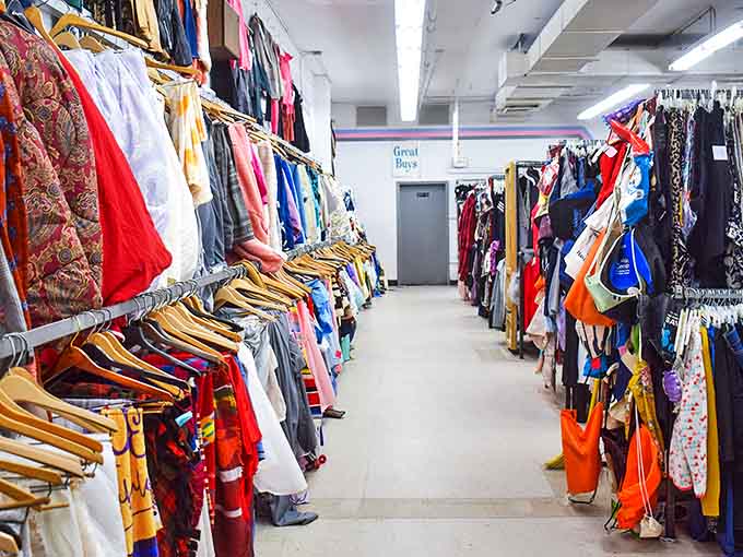 Not just racks, but galaxies of clothing possibilities stretching toward fluorescent horizons. Each aisle promises its own expedition of discovery and potential fashion redemption.