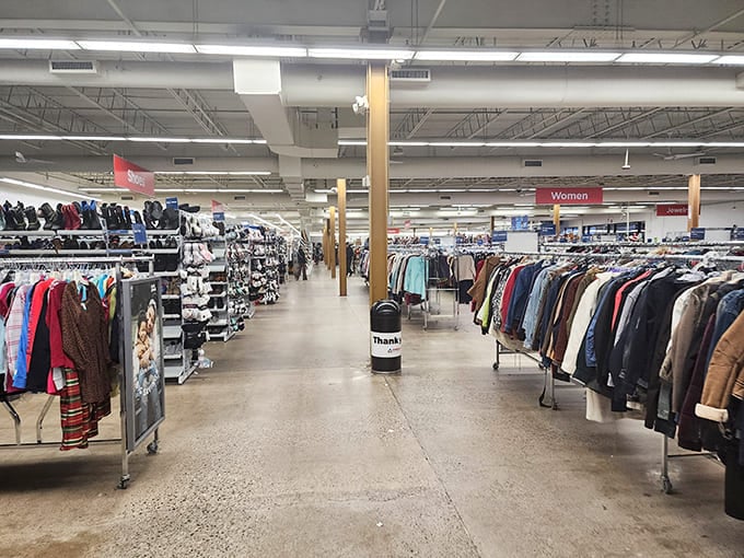 Endless racks stretch toward the horizon like a textile galaxy. Each hanger holds someone's past waiting to become part of your future.