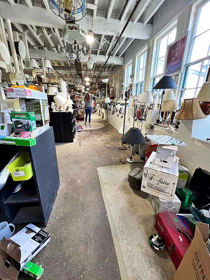 Chandeliers illuminate the path to enlightenment&mdash;or at least to some really fantastic lamps. The ceiling beams frame a corridor of potential discoveries.