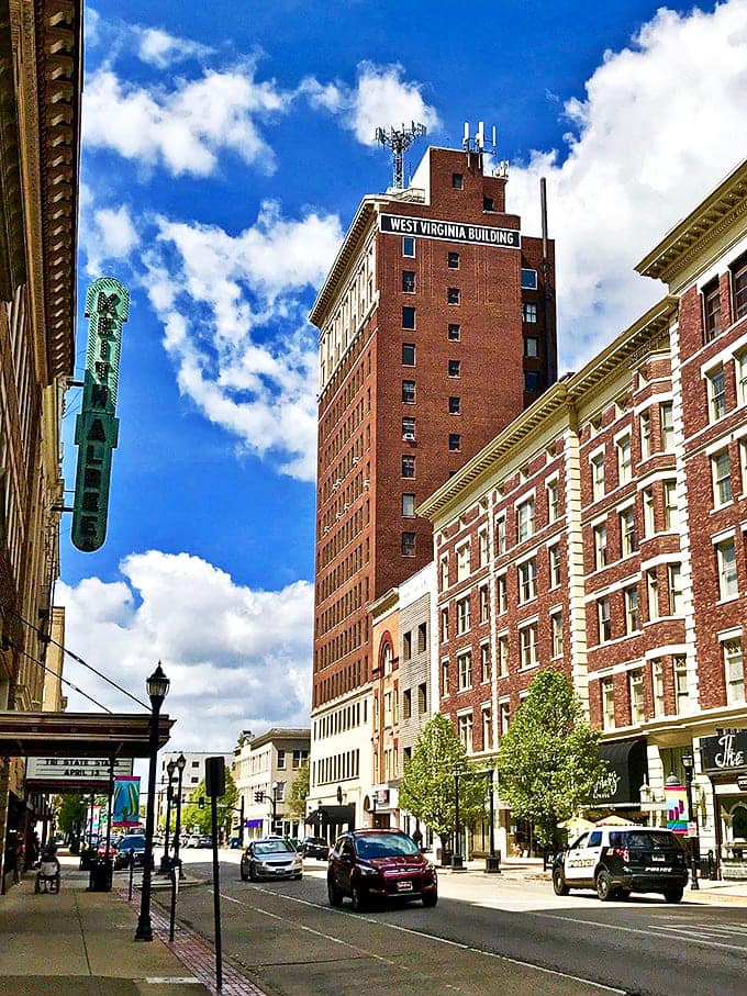 The West Virginia Building stands tall against blue skies, a reminder that affordable cities can still have impressive skylines.