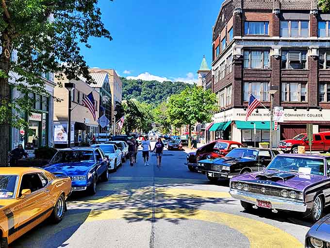 Classic cars line Main Street during what looks like a summer festival&mdash;automotive time travel with a side of small-town charm.
