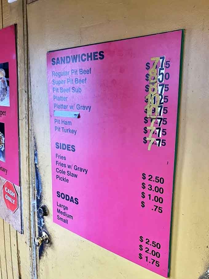 The pink menu board tells you everything you need to know about life's priorities: meat first, sides second, beverages last.