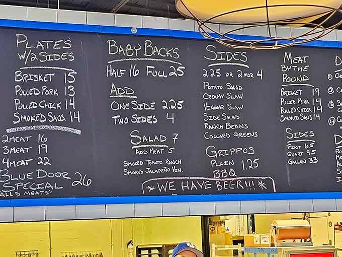 The chalkboard menu tells you everything you need to know: meat, sides, and the all-important note that "WE HAVE BEER!!!"