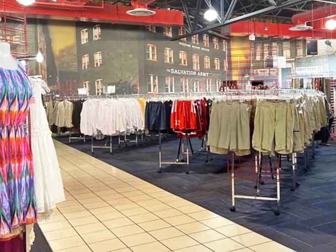 The clothing section stretches like a fashion runway through time. Vintage pieces mingle with contemporary styles in this well-organized wonderland.