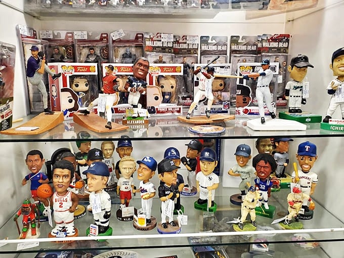 These bobbleheads nod in eternal agreement that sports memorabilia is the universal language of nostalgia. Baseball's frozen moments waiting for new homes.