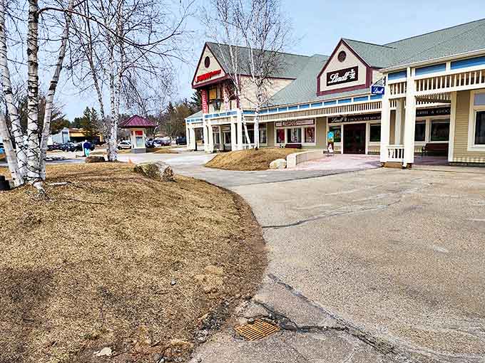 The village-style layout creates a shopping oasis where your credit card can breathe mountain air while being thoroughly exercised.