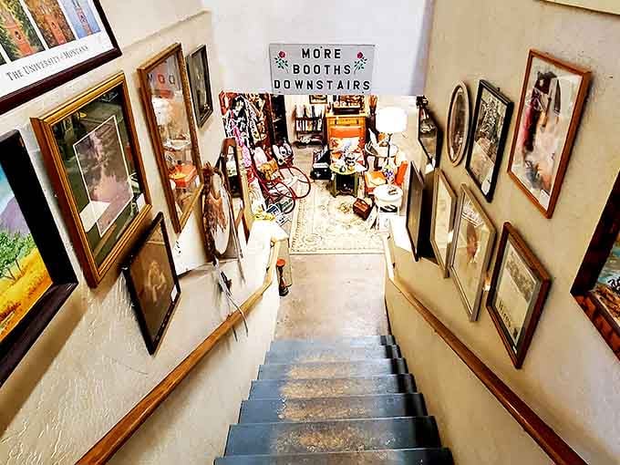 "More booths downstairs" isn't just a sign&mdash;it's a promise of adventure. The stairway to antiquing heaven is lined with history.