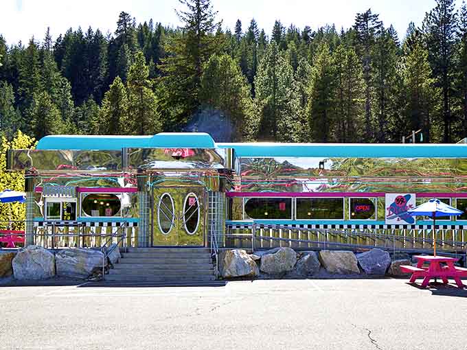 The 59er Diner gleams like a chrome time machine, its turquoise exterior promising milkshakes that require both a straw and a spoon.