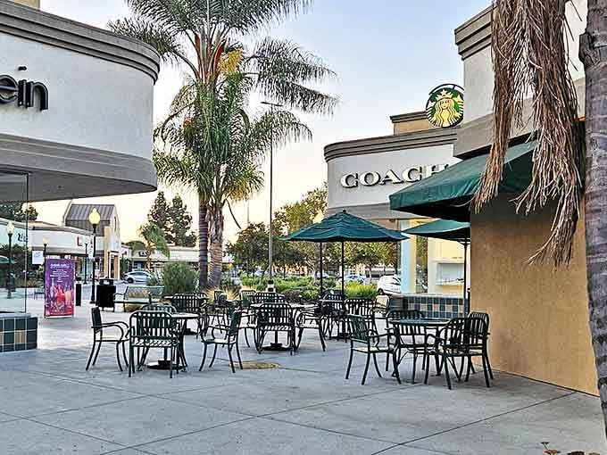 Starbucks and outdoor seating at Gilroy Premium Outlets. Coffee breaks: the unsung hero of successful shopping expeditions.
