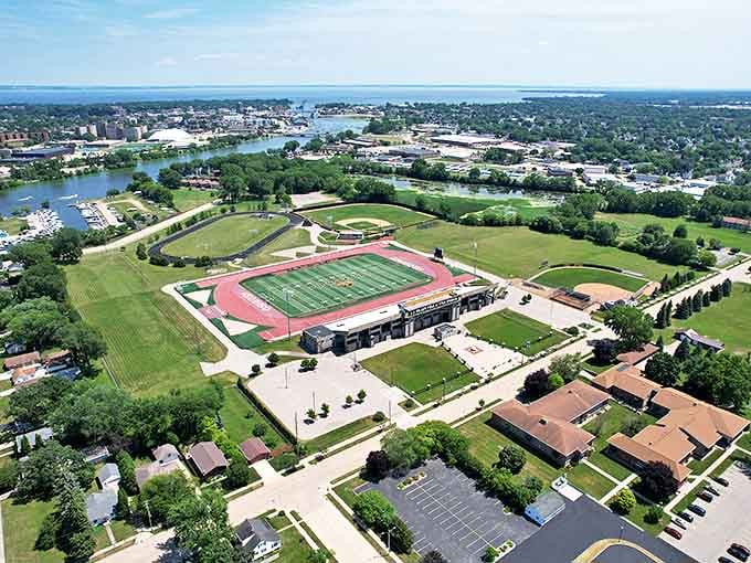 Oshkosh's aerial view showcases its perfect balance of urban amenities and natural beauty – affordable waterfront living at its finest.