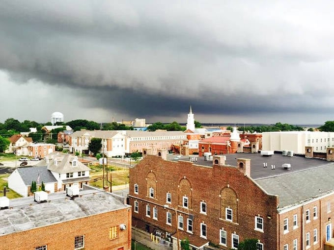 Salem's historic downtown stands proud under dramatic skies, where brick buildings whisper stories of centuries past.
