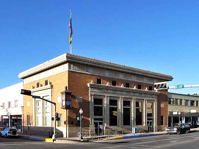 Historic charm meets small-town affordability in Silver City's downtown district, where this stately brick building anchors a street filled with character.