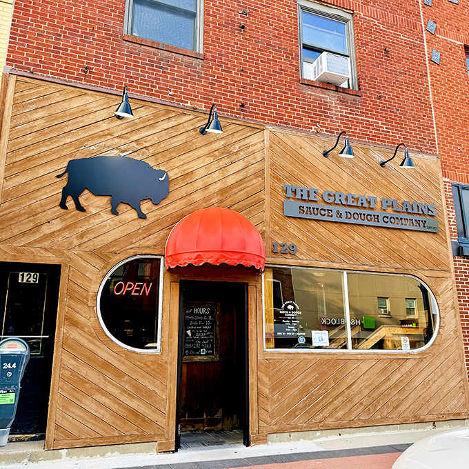 Great Plains' wooden buffalo facade stands as proudly as its pizza reputation in downtown Ames - rustic, bold, and unmistakably Iowan.