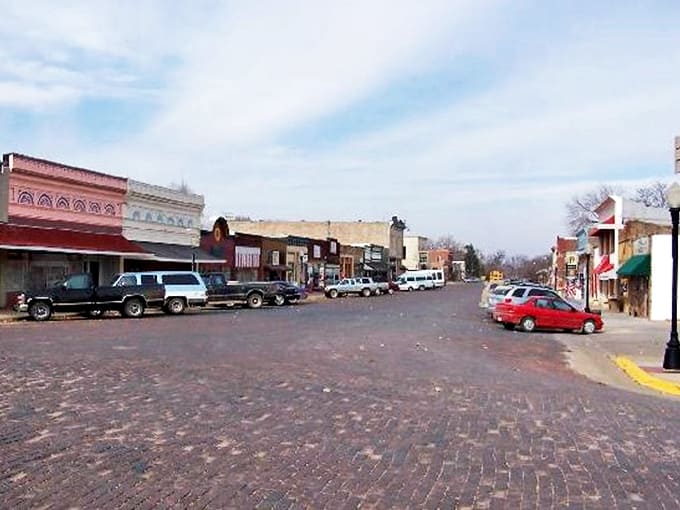 The brick-paved main street of Cottonwood Falls offers a postcard-perfect view that captures the heart of small-town Kansas.
