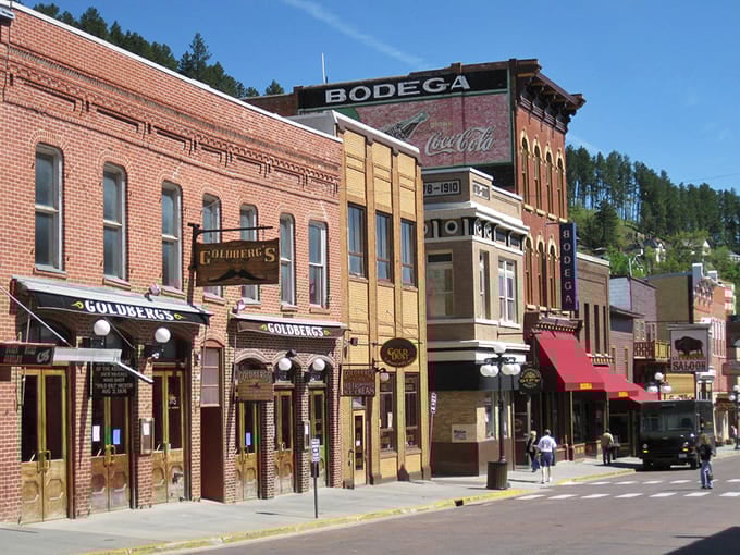 Historic buildings in Deadwood stand proudly against the backdrop of pine-covered hills, inviting exploration of the Black Hills' heart.