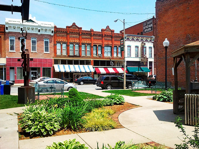 Historic storefronts line up like dominoes, each one holding secrets of river town commerce.