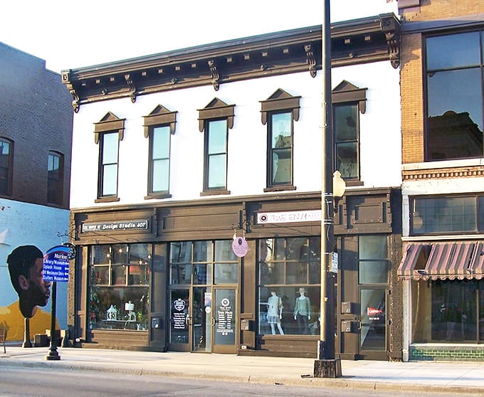 Charming local storefronts line the sidewalk, inviting you to enjoy a peaceful afternoon exploring the unique character of downtown Marion.