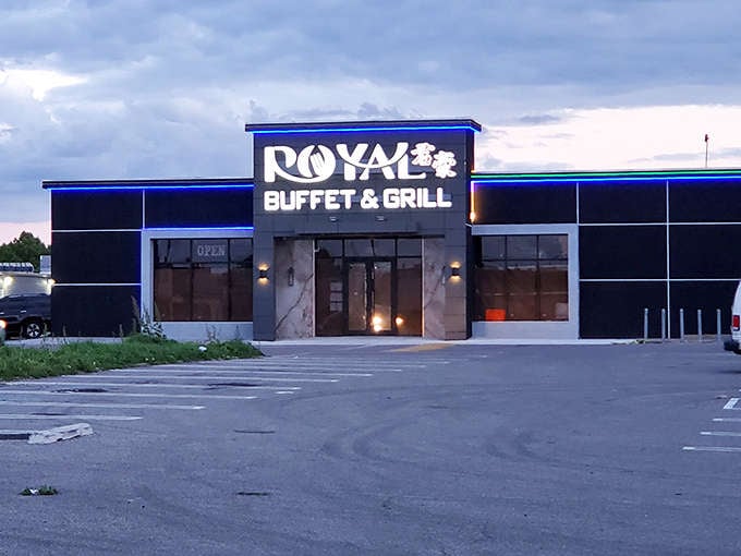 As evening falls, Royal Buffet's illuminated sign glows with promise. The blue accent lighting adds a touch of elegance to your all-you-can-eat experience.